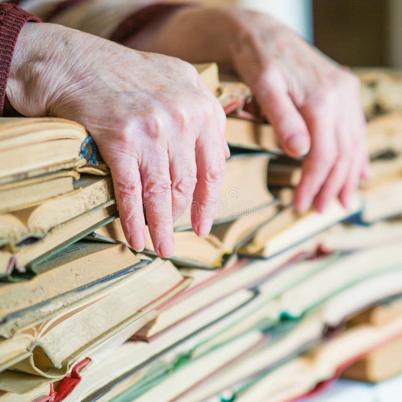 Never Too Old To Learn - Hands of Old Woman Reading Book Stock Photo ...