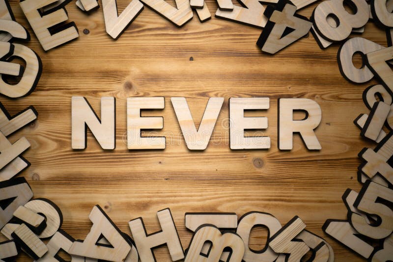 `Now or Never` Word on Modern Board on a White Wooden Background, Top ...