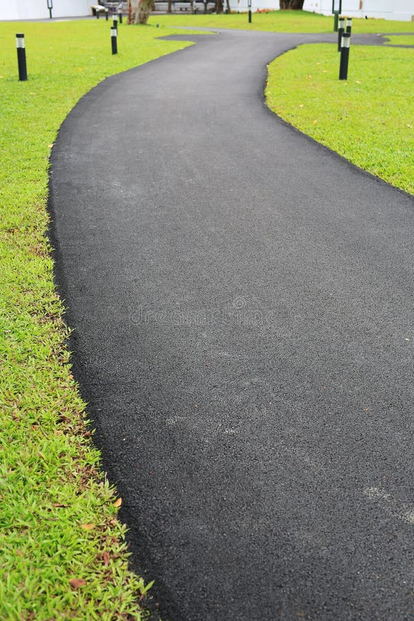 New Asphalt Which is a Smooth Road Walkway in the Green Grass Garden ...