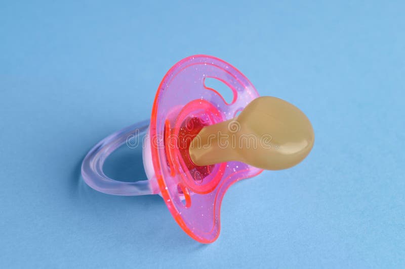New Baby Pacifier on Light Blue Background, Closeup Stock Photo - Image ...