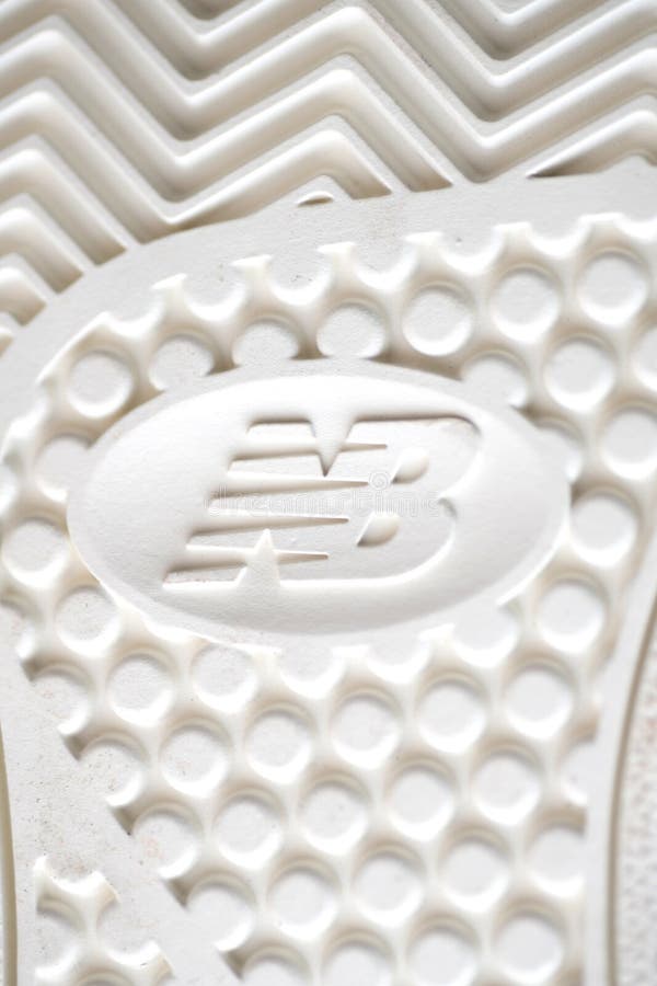 New Balance on a Rubberized Sneaker Sole. New Balance Logo Close-up ...
