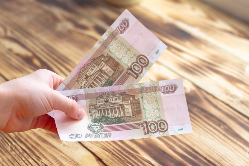 A New Bill of One Hundred Russian Rubles in a Person& X27;s Hand Stock ...