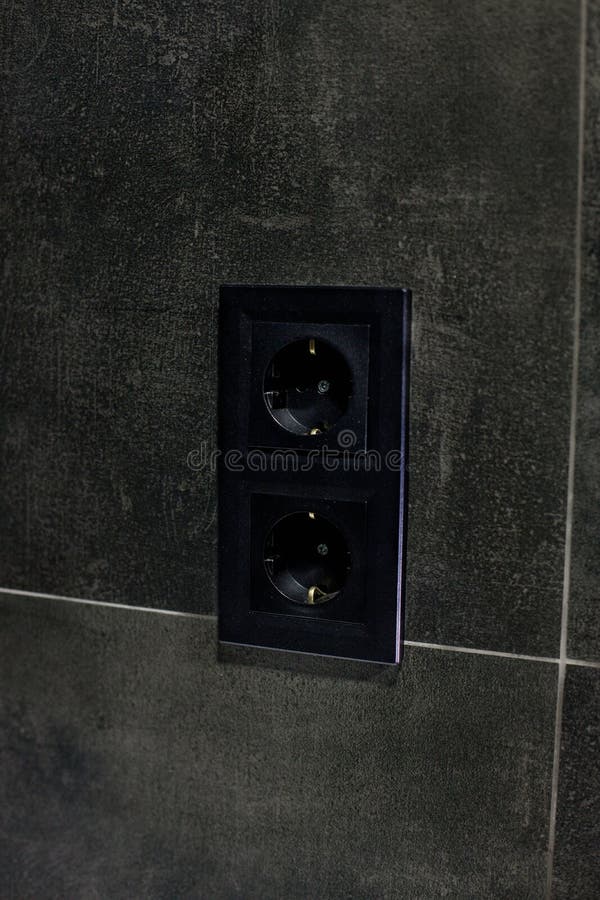 New Black Rosette on a Ceramic Tile of Black Color. Electrical Outlet ...