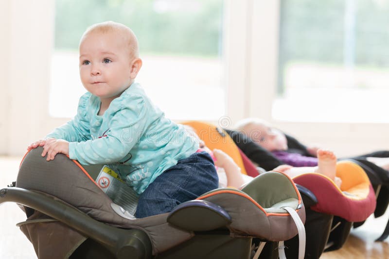 New-born Babies in Toddler Group Lying in Baby Shells Stock Photo ...