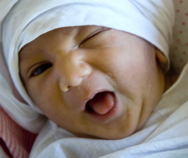 New Born Baby winking stock image. Image of child, closeup - 12496445