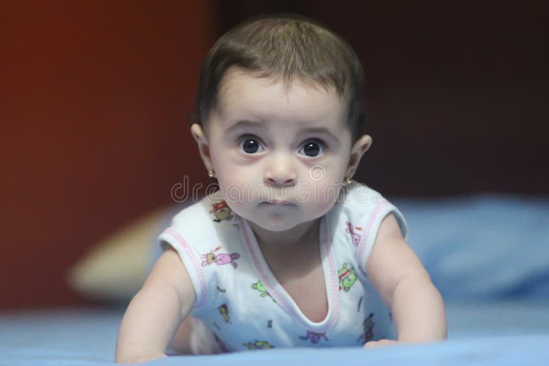Baby girl staring stock photo. Image of colorful, playing - 57666988