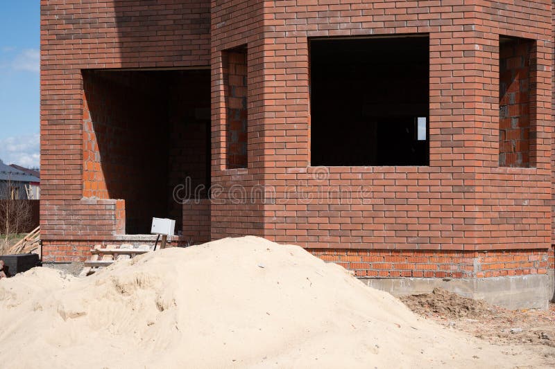 New Brick House Construction Site with Pile of Sand Stock Image - Image ...