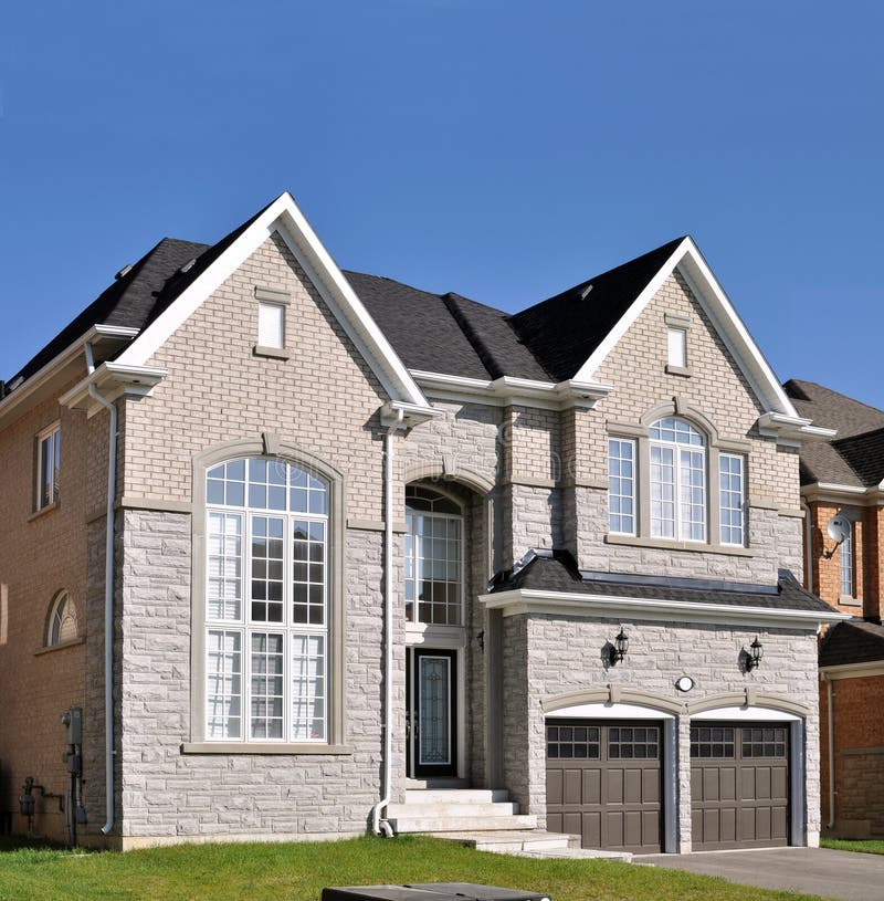 New Brick House with a Double Garage Stock Photo - Image of house ...