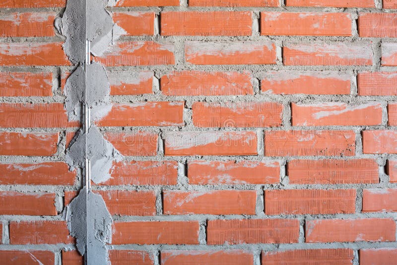A New Brick Wall with Construction Mark Under Stock Photo - Image of ...