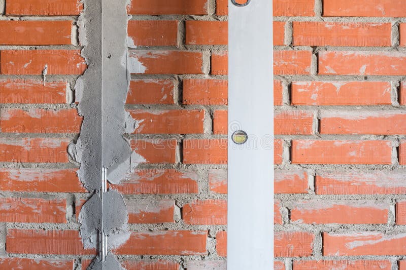 A New Brick Wall with Plaster and Level Stock Photo - Image of abstract ...
