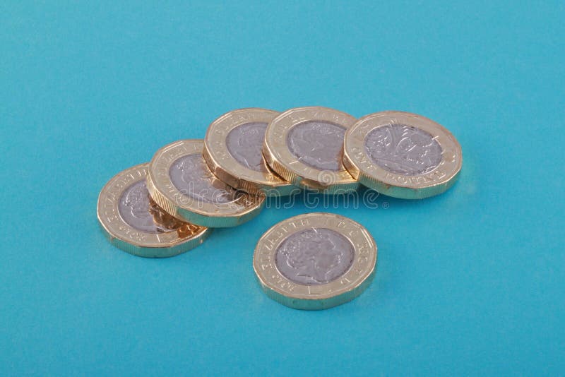 New British Uk One Pound Coins Blue Background Stock Photos - Free ...