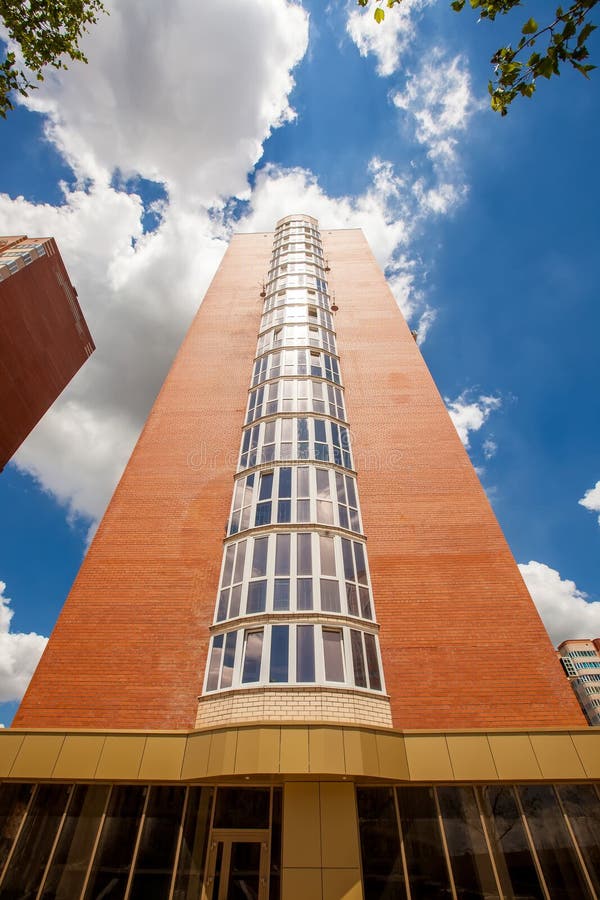 New Multi-storey Residential Building on a Blue Sky Stock Image - Image ...
