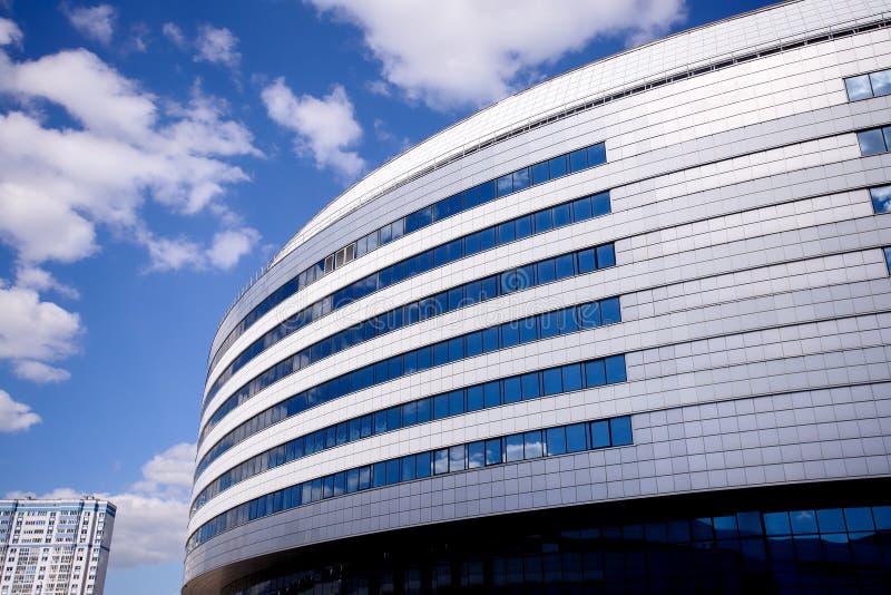 The New Building of the Sports Complex Against the Blue Sky. Glass ...
