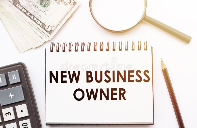 NEW BUSINESS OWNER - Text on Torn Paper on Dark Desk in Sunlight Stock ...