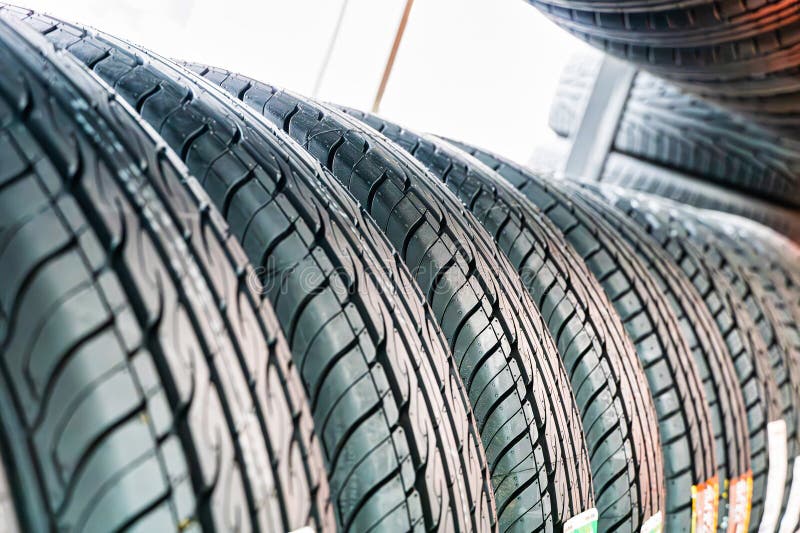 New Car Tires Stacked in a Store Stock Photo - Image of automotive ...