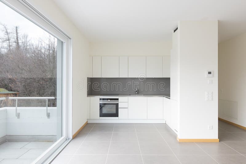 New, Clean and Empty Kitchen in the Empty Room Stock Image - Image of ...