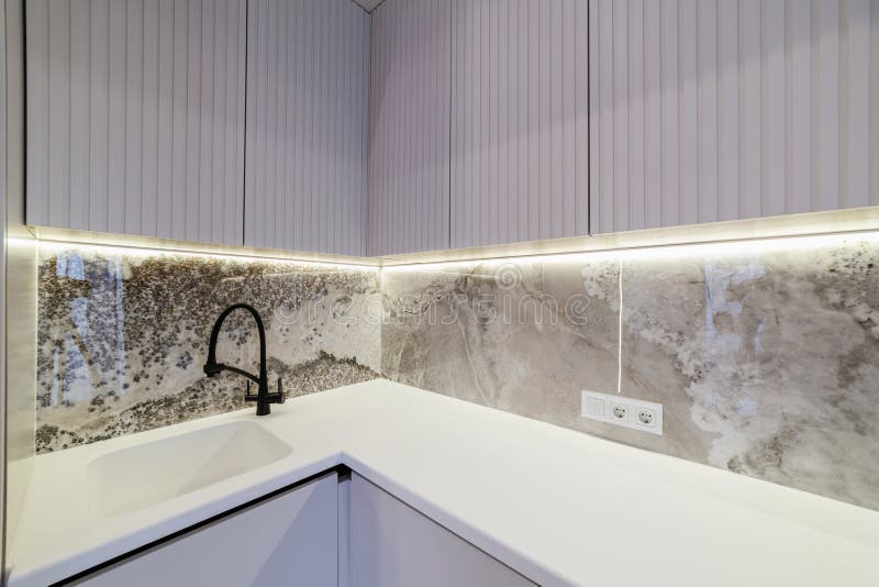 New Clean Empty White Kitchen with Lighting and Countertop Stock Image ...