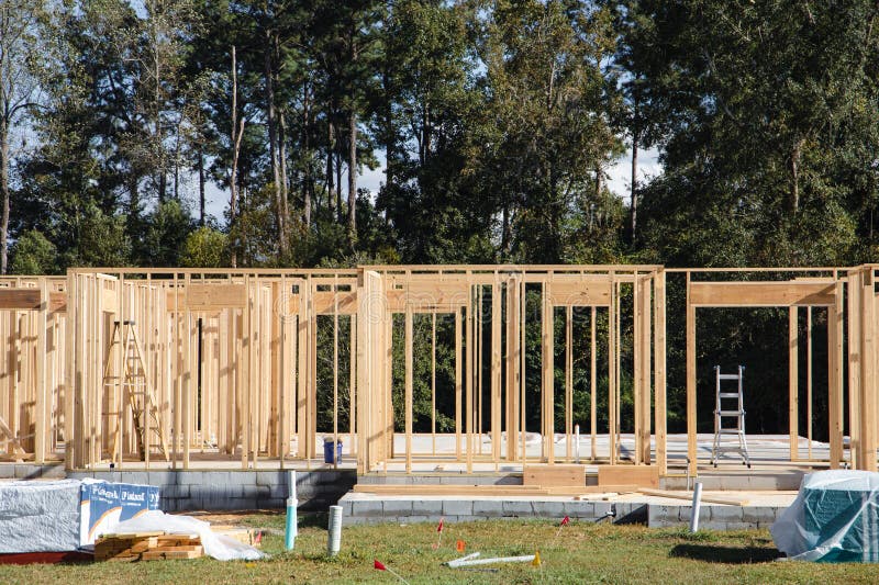 New Construction House Frame Framing Being Built with a Foundation and ...