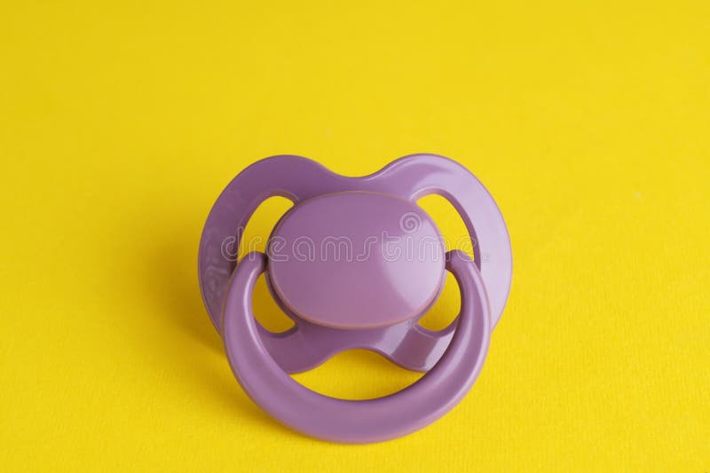 New Cute Baby Pacifier on Yellow Background Stock Image - Image of ...