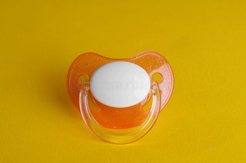 New Cute Baby Pacifier on Yellow Background Stock Image - Image of ...
