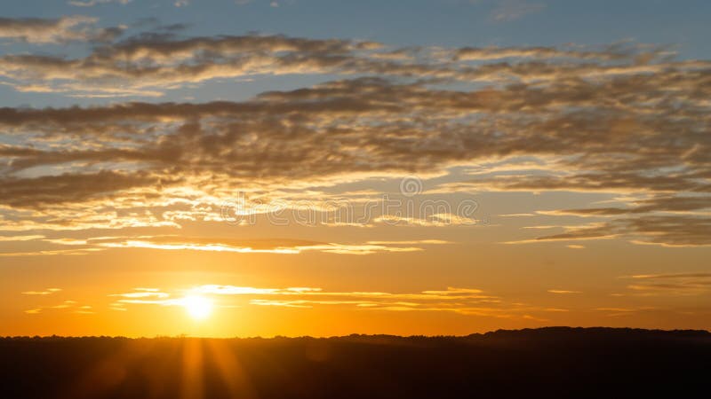 A New Dawn: Sun Rising with Stunning Clouds Stock Illustration ...