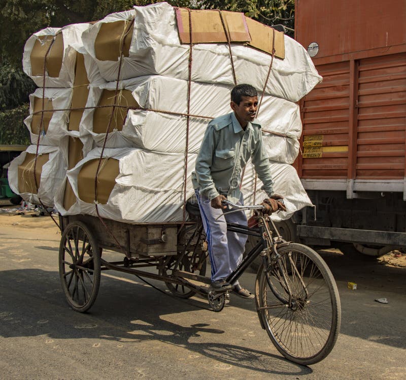 New Dehli, India, Feb 19, 2018: Man Carrying Massive Load on Bicycle ...
