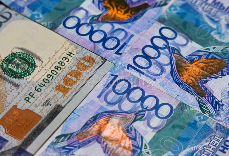 New 100 Dollar and 10,000 Tenge Notes Connected at the Corners Stock ...