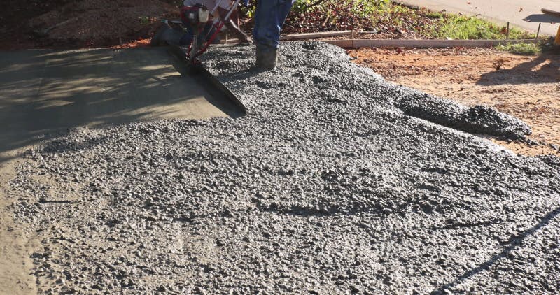 New Driveway Construction Involves the Use of a Machine To Align the ...