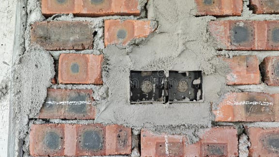 Electrical Socket Hole Mounting Frame on the Brick Concrete Wall Stock ...