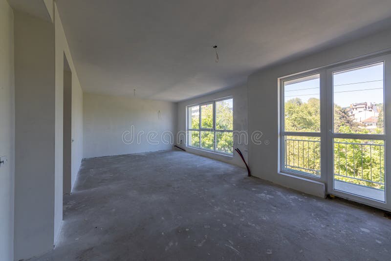 New Empty Room Under Construction. Plaster Walls. New Home. Concrete ...