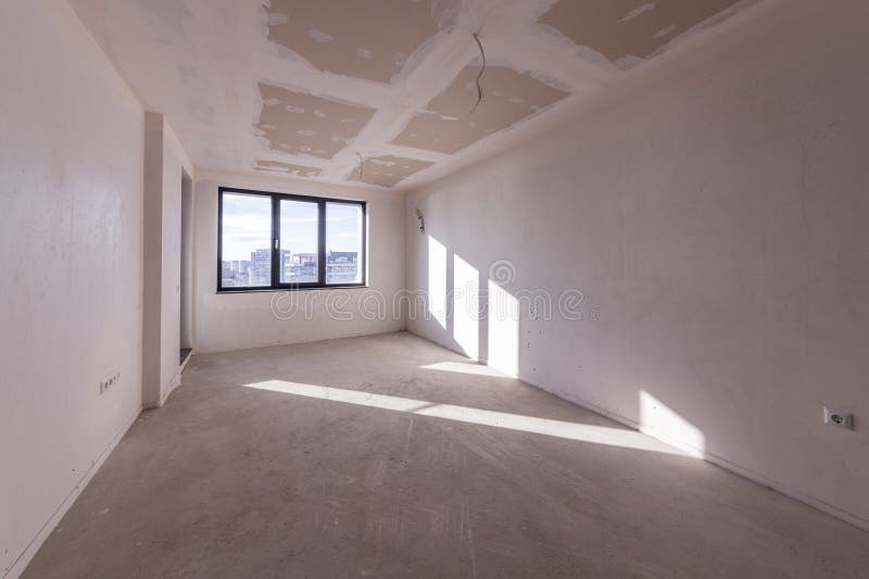 New Empty Room Under Construction. Plaster Walls. New Home. Concrete ...