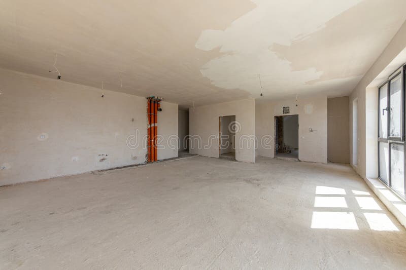 New Empty Room Under Construction. Plaster Walls. New Home. Concrete ...