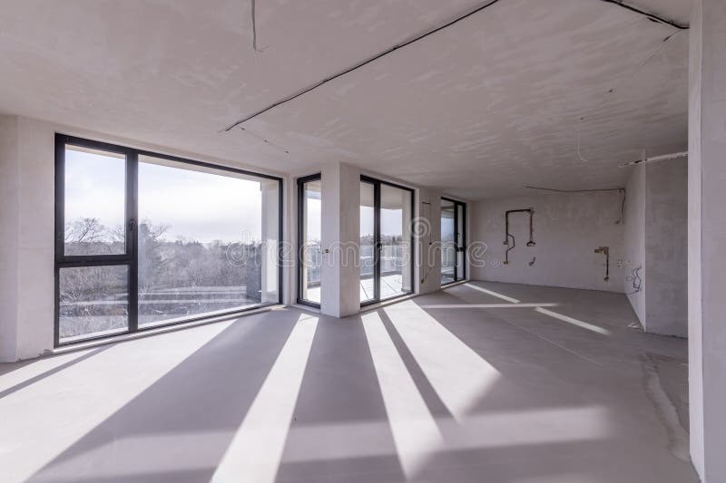 New Empty Room Under Construction. Plaster Walls. New Home. Concrete ...