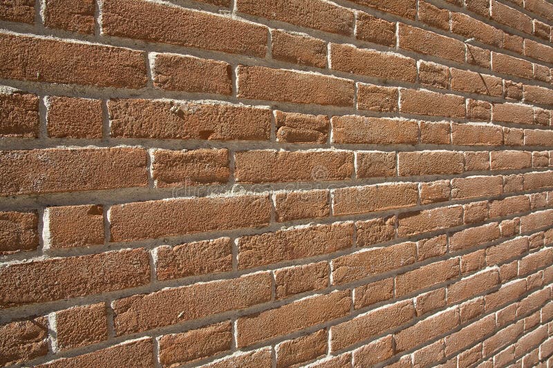 Exposed Brick Exterior with Traditional Shutters and Hanging Baskets in ...