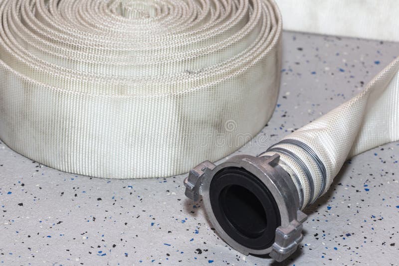 New Fire Hose, on the Floor of the Fire Station Stock Photo - Image of ...