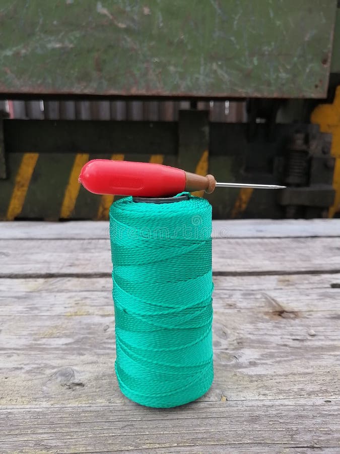 Bobbin Of Green Sewing Thread With Pin Stock Photo - Image of ...