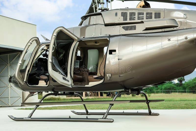 New Helicopter with Open Cabin Doors on Helipad Outdoors Stock Photo ...