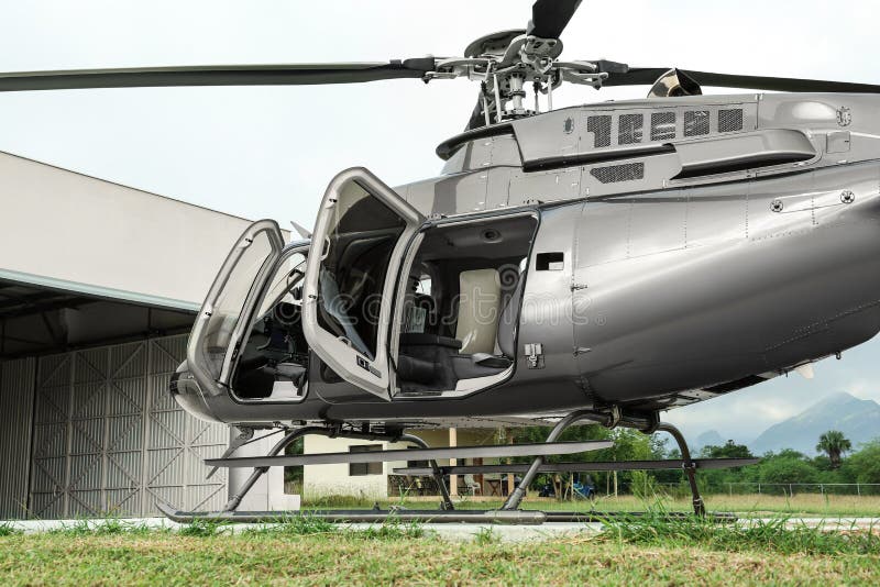New Helicopter with Open Cabin Doors on Helipad Outdoors Stock Image ...