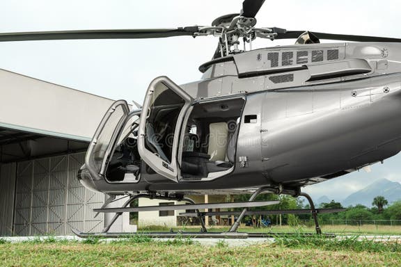 New Helicopter with Open Cabin Doors on Helipad Outdoors Stock Image ...