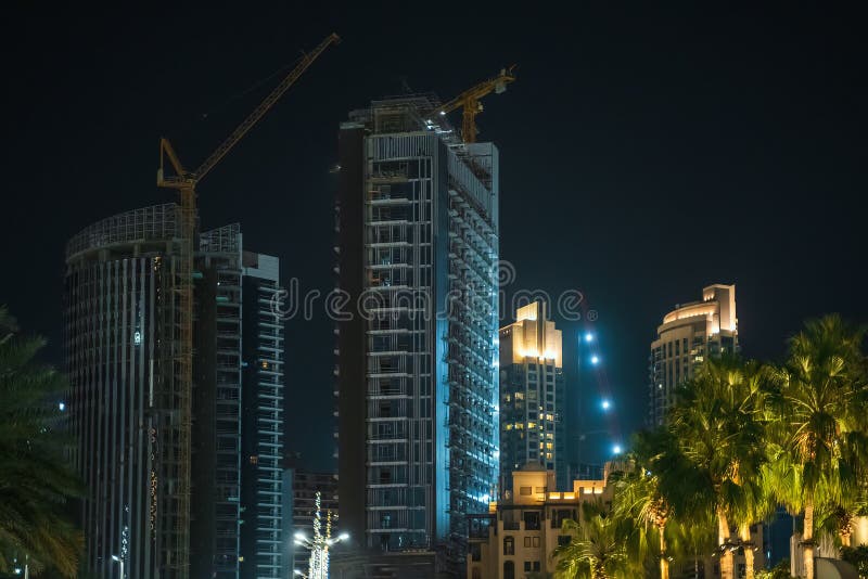 New High Rise Building Construction Site in Dubai at Night. Fast Dubai ...
