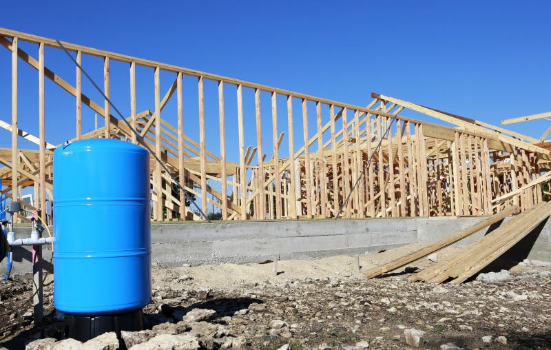 Deep Water Well Set Up in Front of Home Construction. Stock Photo ...