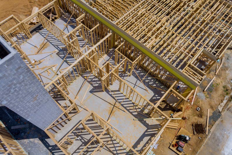 New Home Construction Framing of a House Under Construction Stock Image ...