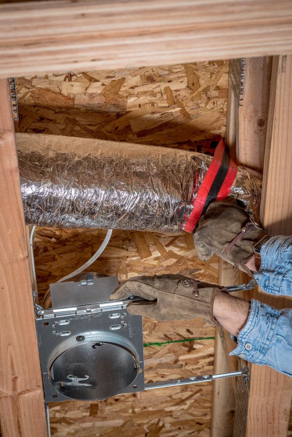 Construction Worker Adjusts Some Duct Work with His Hands Stock Image ...