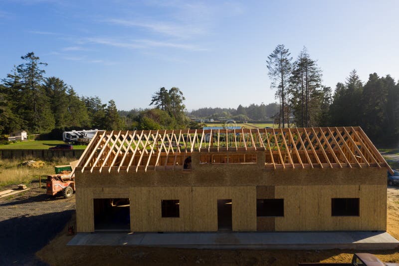 New Home Under Construction in Rural Area with Pine Trees Around it ...