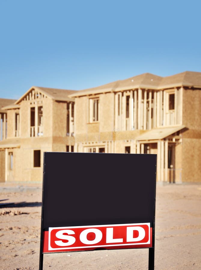 New homes with sold sign stock photo. Image of purchasing - 18616658