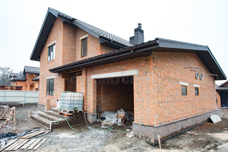 A new house being built. stock photo. Image of abode - 107173010