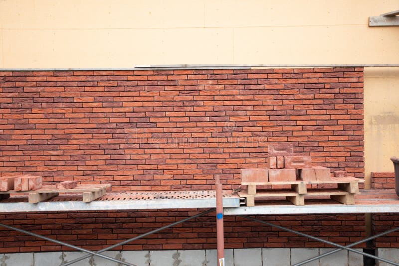 A New House is Being Built, the Beginning of Brickwork with Red Bricks ...