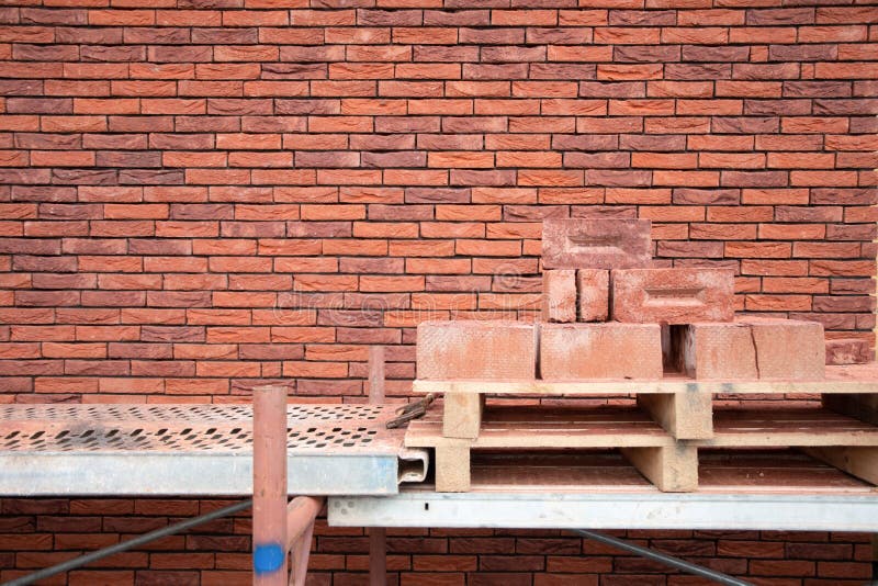 A New House is Being Built, the Beginning of Brickwork with Red Bricks ...