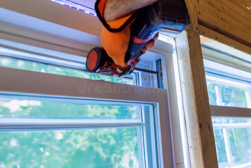 In New House, Construction Worker Installs Plastic Windows Using a ...
