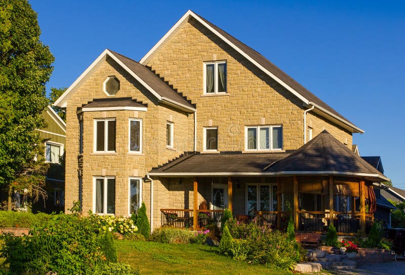 New House with a Large Porch Stock Photo - Image of stone, lawn: 75654676